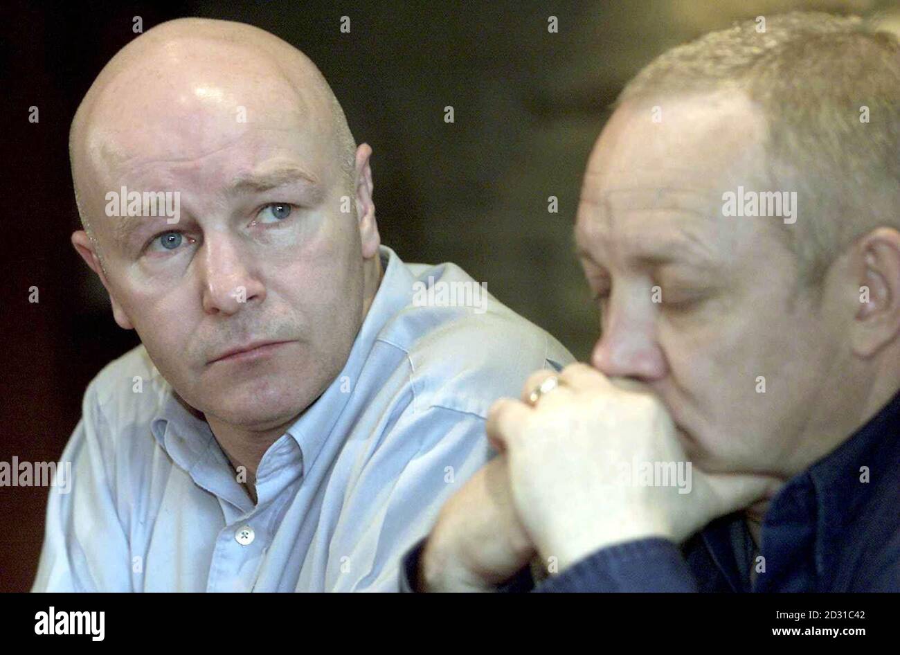 Injured boxer Paul Ingle's trainer Steve Pollard (L) and manager Frank ...