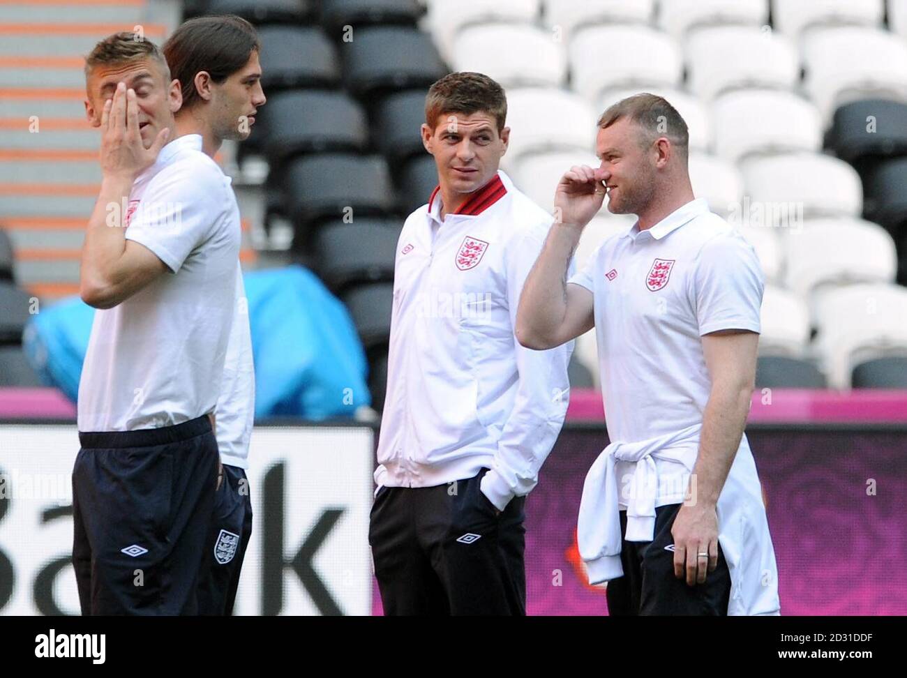 Wayne Rooney speaks with Rob Green, Andy Carroll and Steven Gerrard ...