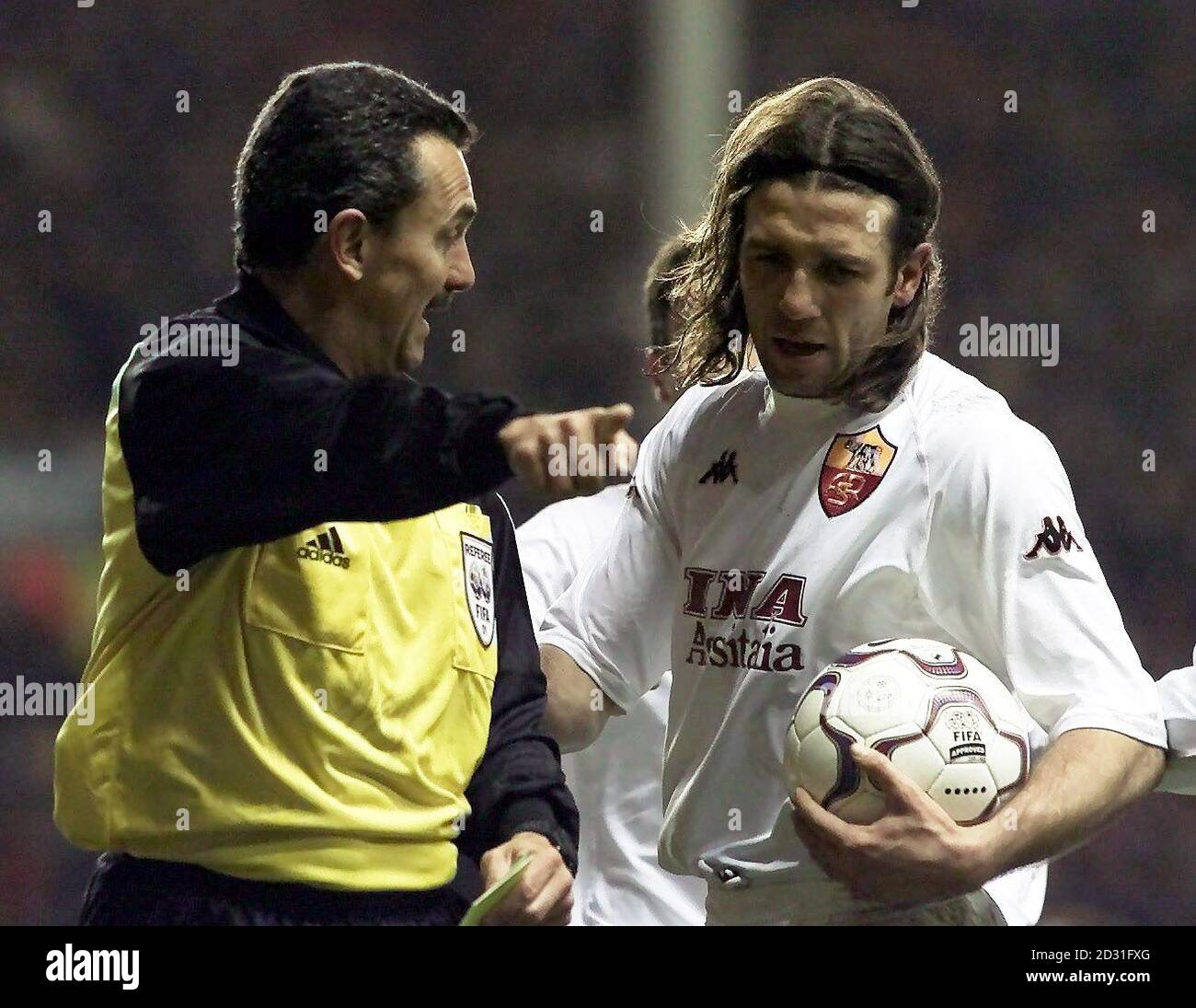 Spanish referee Jose Maria Garcia-Aranda (left) points for a corner ...