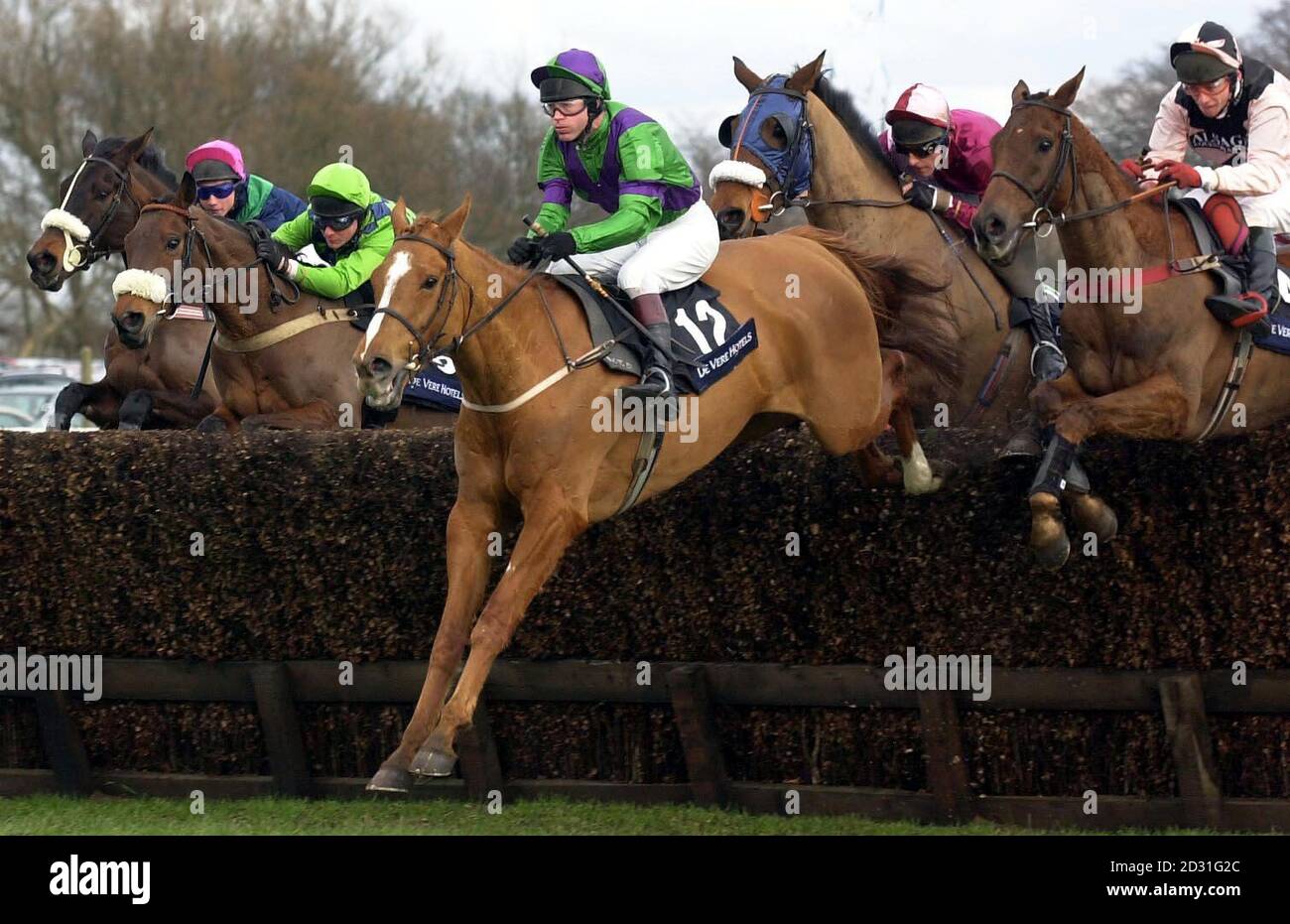 Frantic Tan and Carl Llewellyn (number 12) go on to win the De Vere Gold Cup Chase at Haydock ...
