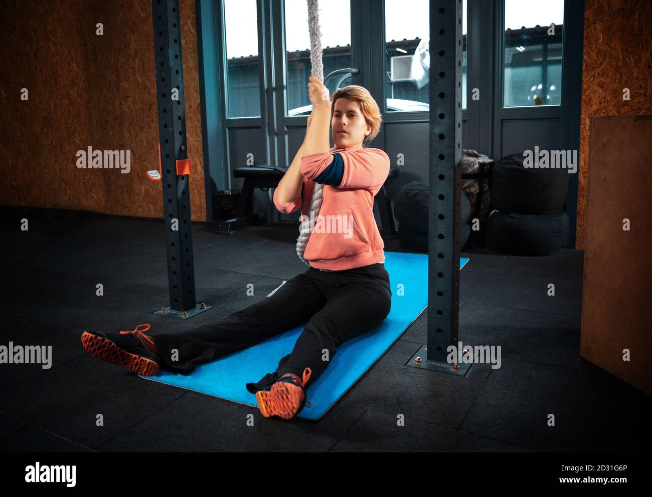 Athletic. Disabled woman training in the gym of rehabilitation center ...
