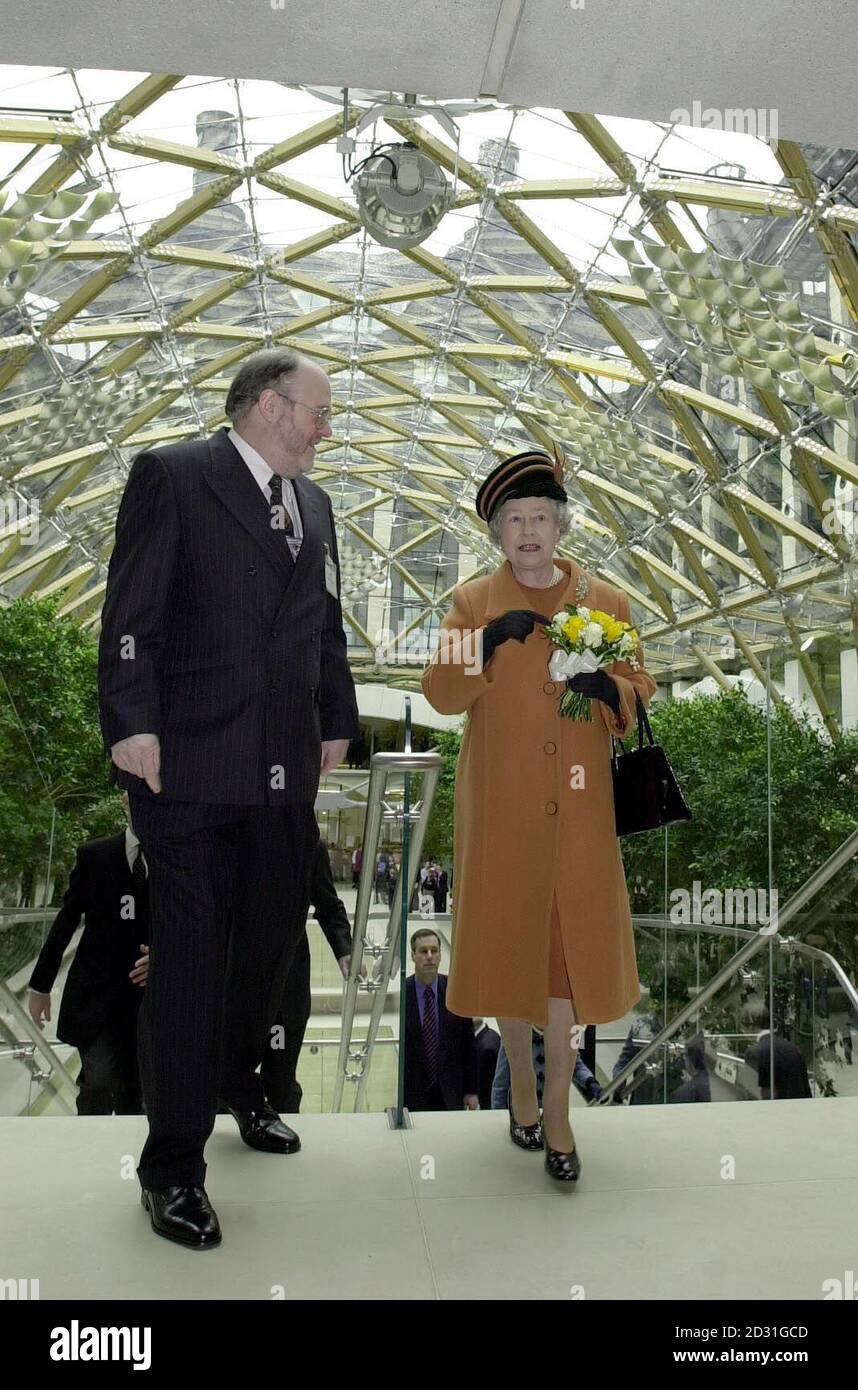 Britain's Queen Elizabeth II walks up steps from the atrium, with Mr ...