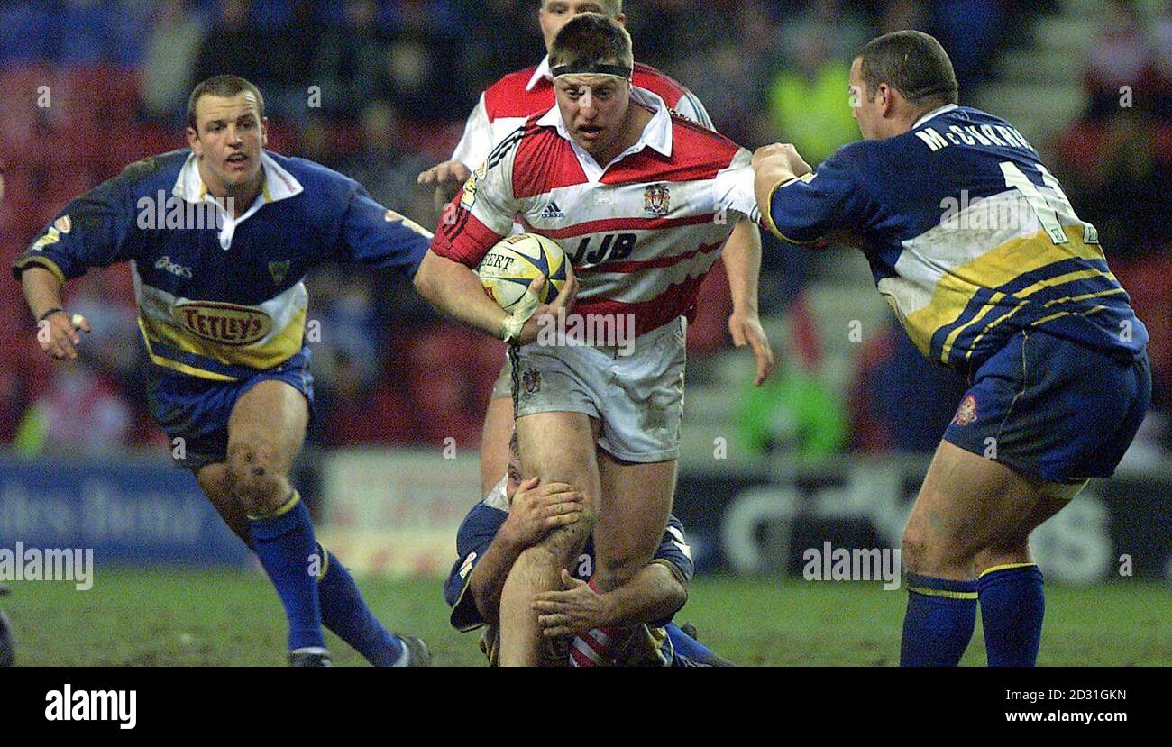 Wigan's David Furner (centre facing) still makes progress despite the ...