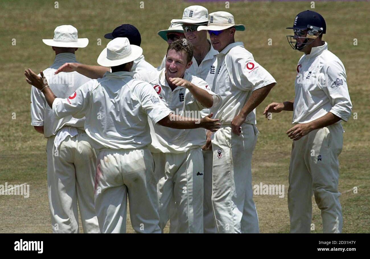 England bowler Robert Croft celebrates (centre) after wicket-keeper ...