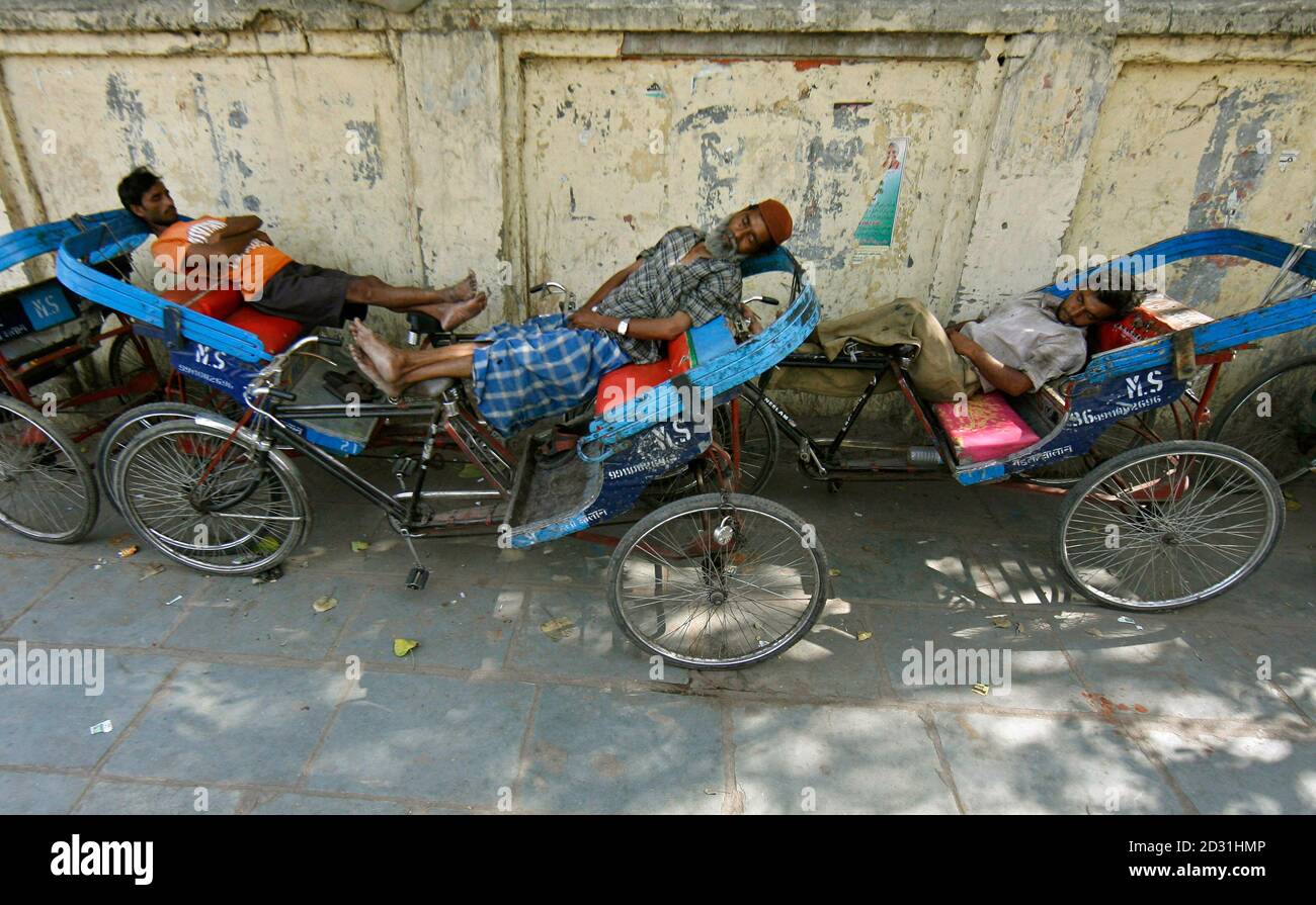 Rickshaw pullers in delhi hi-res stock photography and images - Alamy