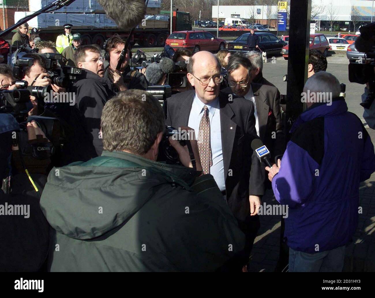 Chief vet Jim Scudamore, surrounded by the media, arrives at the ...