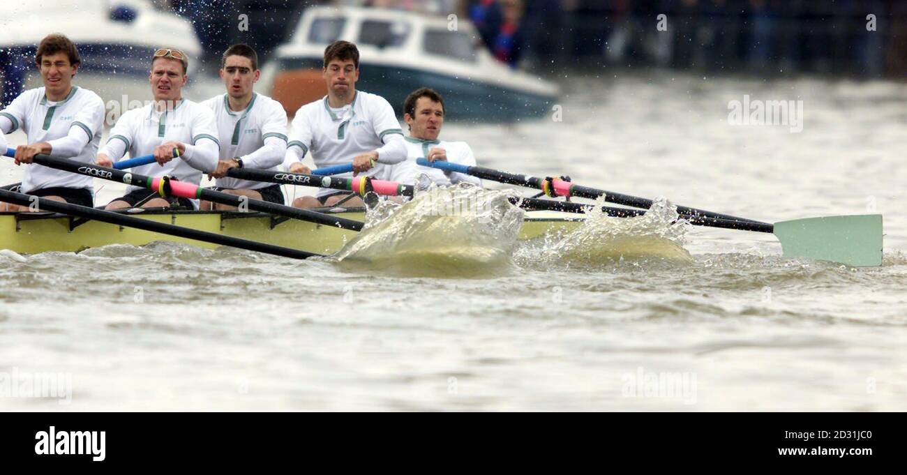 Cambridge's Colin Swainson (furthest left) losing his oar as the Oxford ...