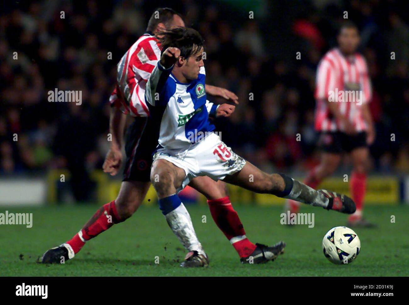 Blackburn Rovers' Matt Jansen (front) holds off a challenge from ...