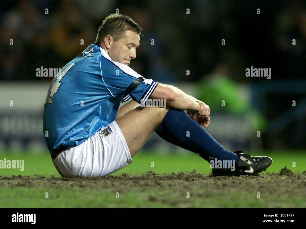 Manchester citys defender steve howey sits down in despair hi-res stock ...