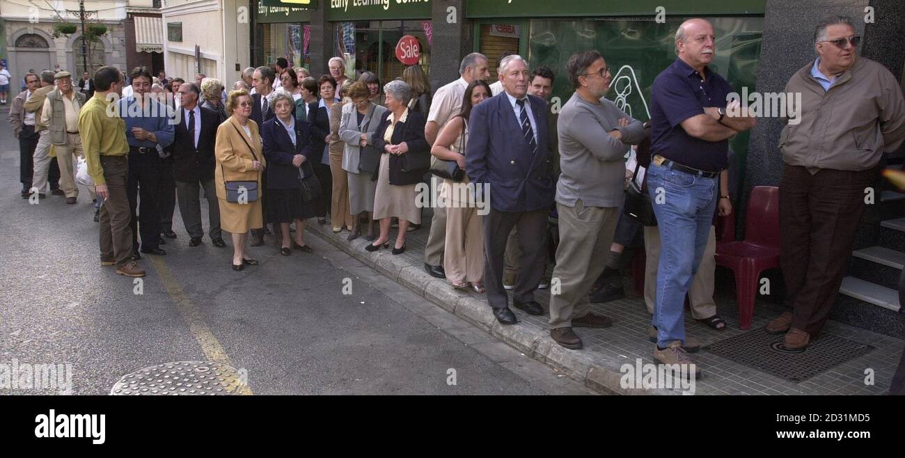 Gibraltarians queue outside the Gibraltar Philatelic Bureau to buy the ...