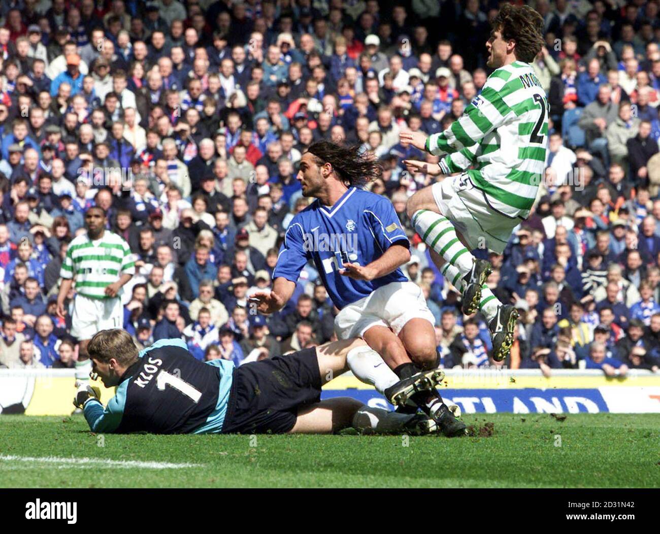 Rangers' goalkeeper Stefan Klos (left) and Lorenzo Amoruso can only ...