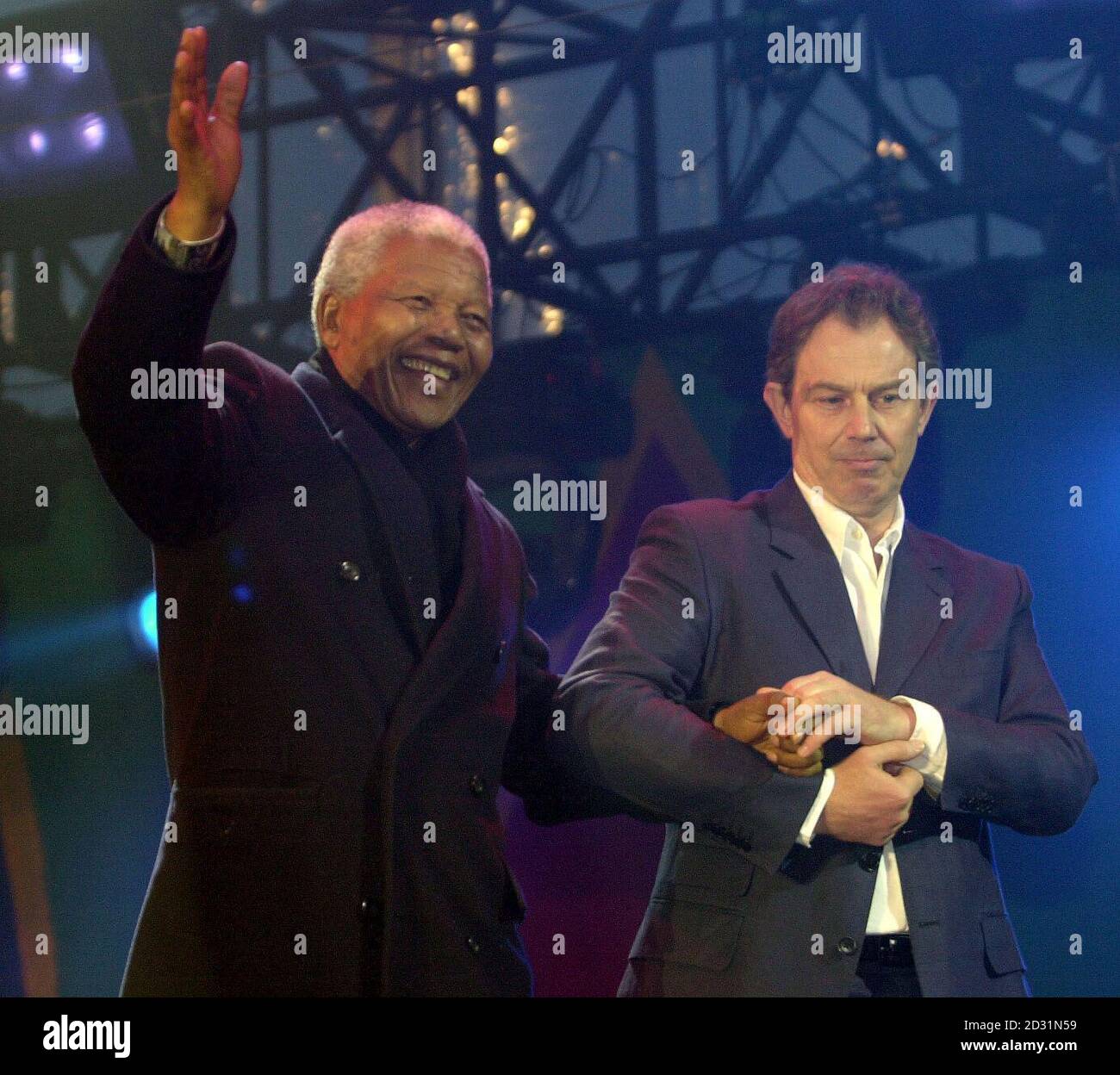 Prime Minister Tony Blair (R) with Nelson Mandela on stage, during the ...