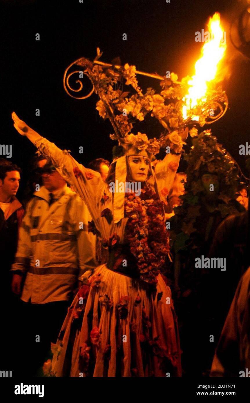 A fire-dancer marches on the top of Calton Hill in Edinburgh as part of ...