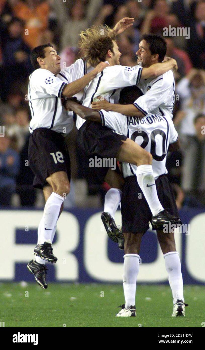 Valencia's Mendieta (centre) celebrates scoring the third goal against ...