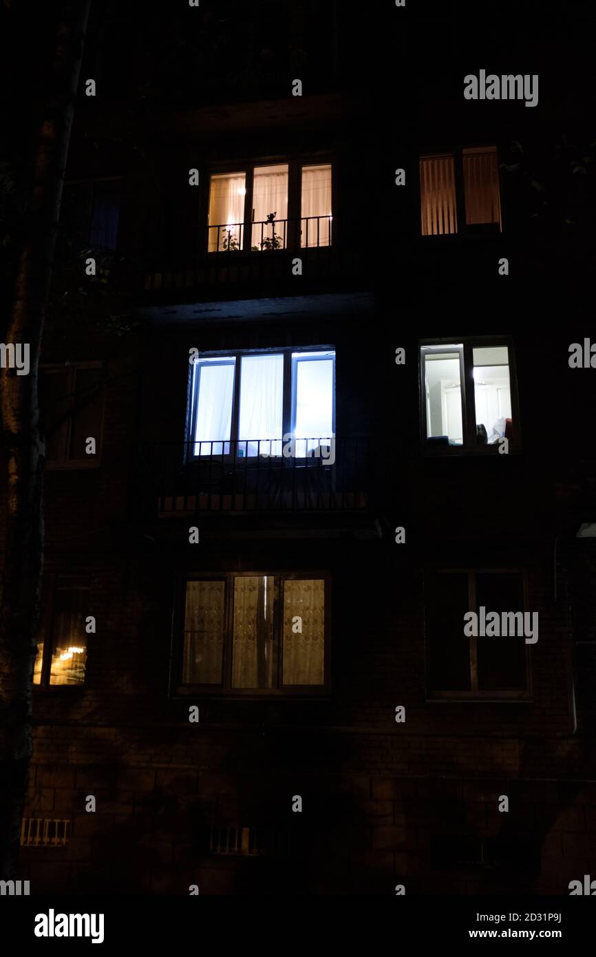glowing windows in a residential multi-storey building at night Stock ...
