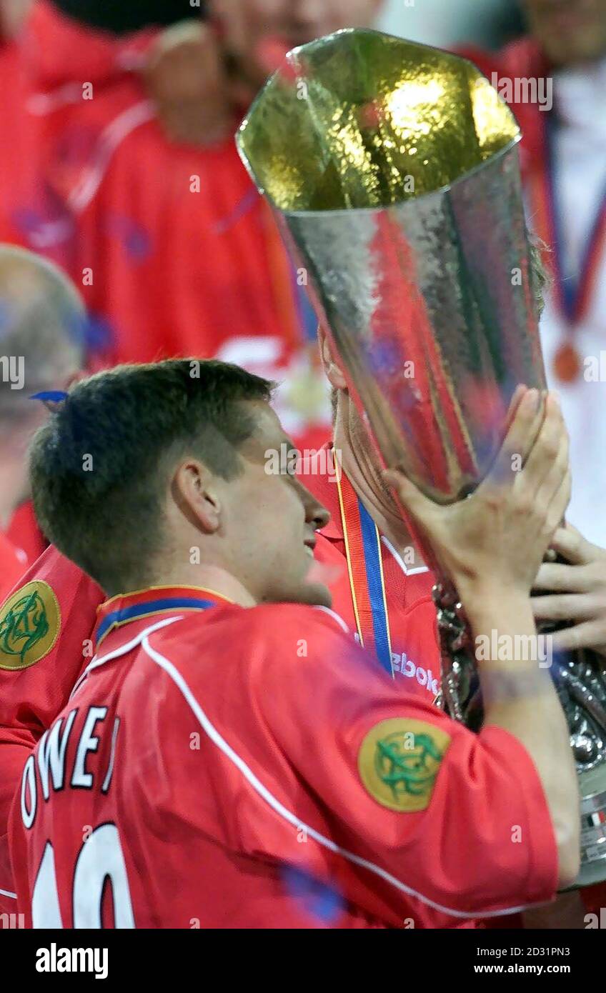 Liverpool striker Michael Owen holds aloft the UEFA cup after his side ...