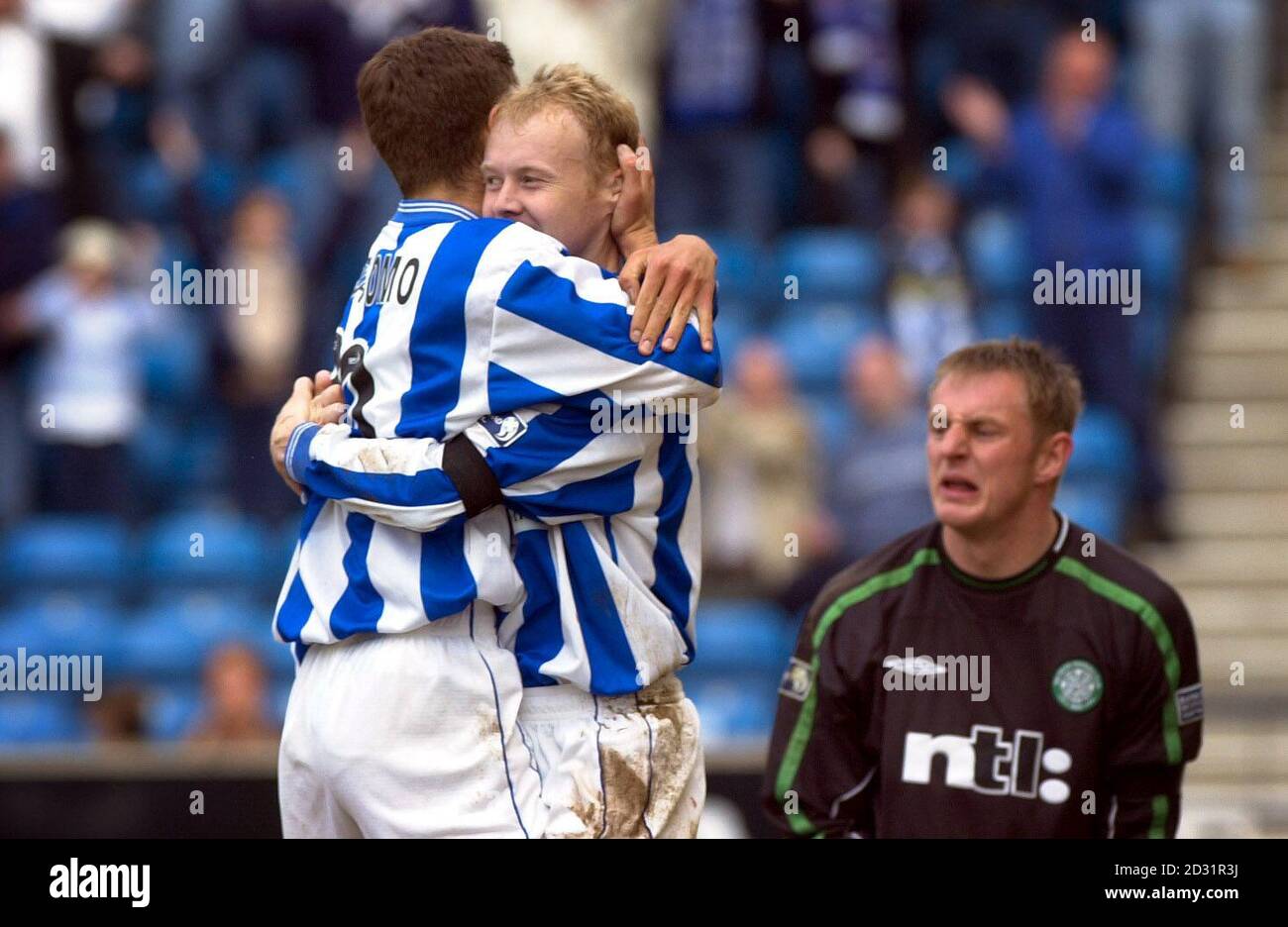 Kilmarnock goalscorer Alan Mahood (centre) is hugged by teammate Paul ...