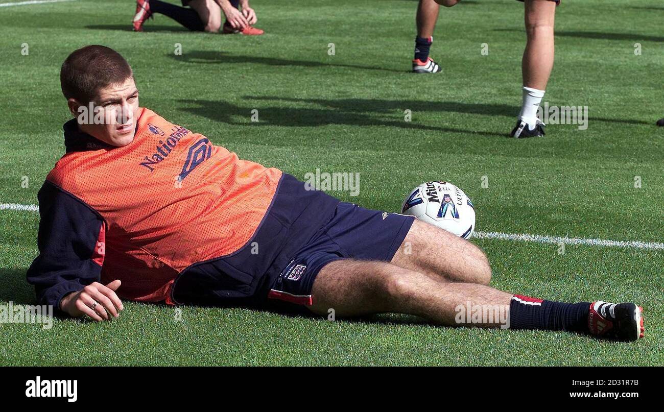 Liverpool and England footballer Steven Gerrard stretches out during ...