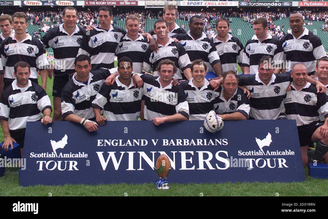 The Barbarians team celebrate their 43-29 victory over England with the ...