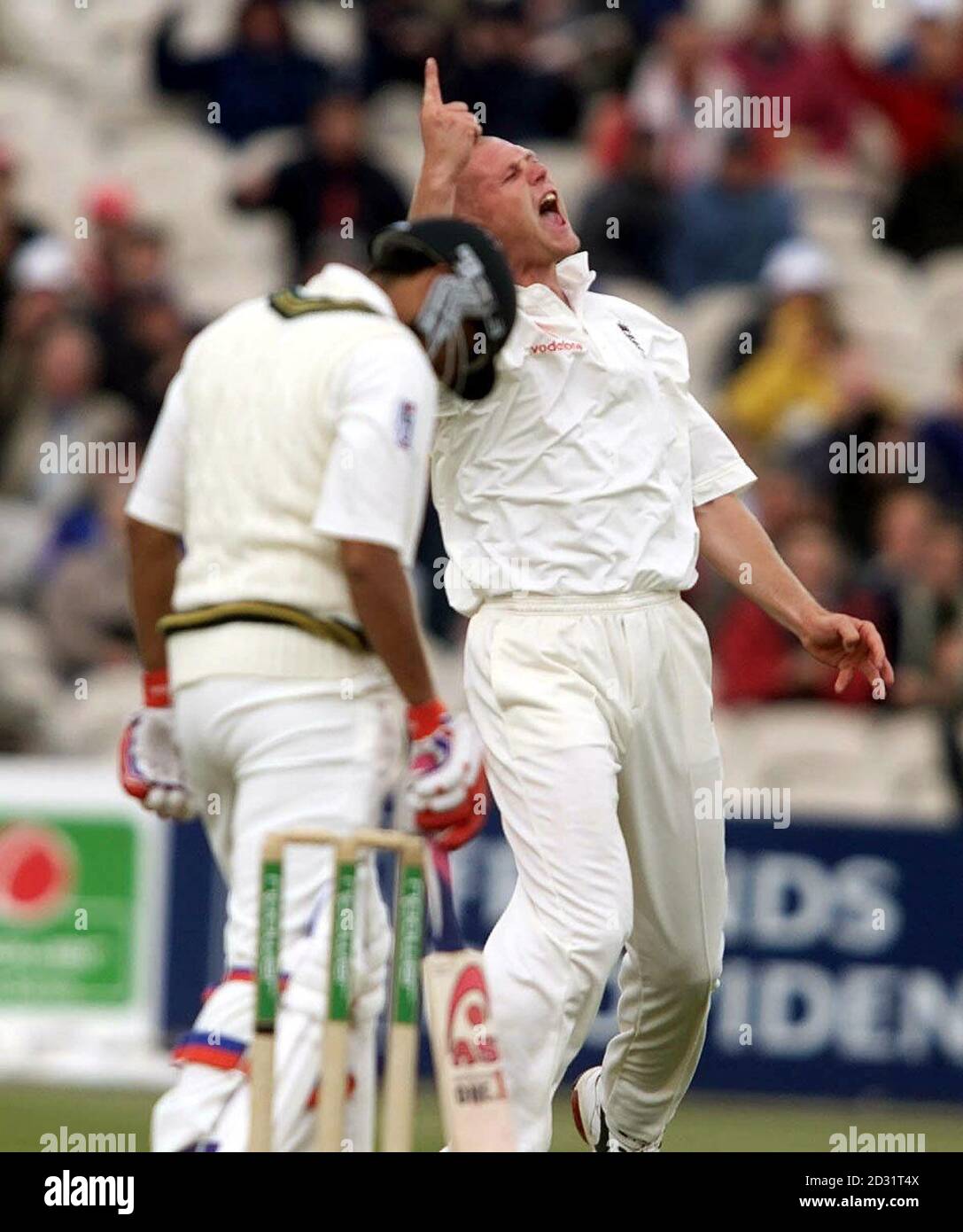 England's Matthew Hoggard (right) celebrates his first test wicket ...