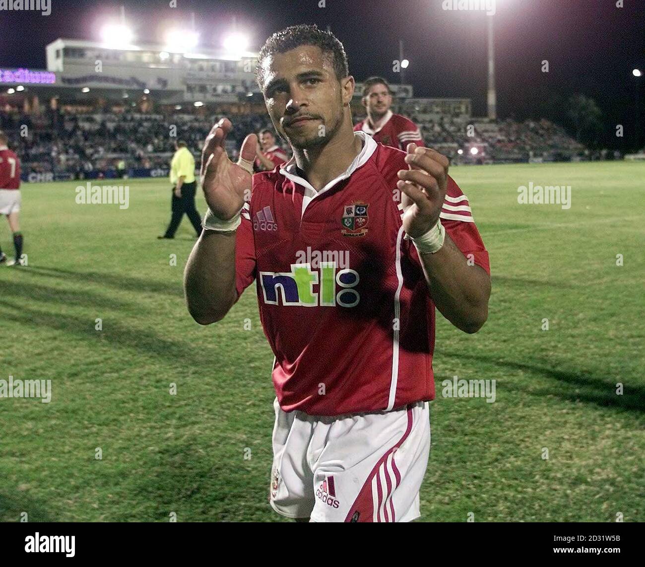 Jason Robinson acknowledges the crowd after his five try performance ...