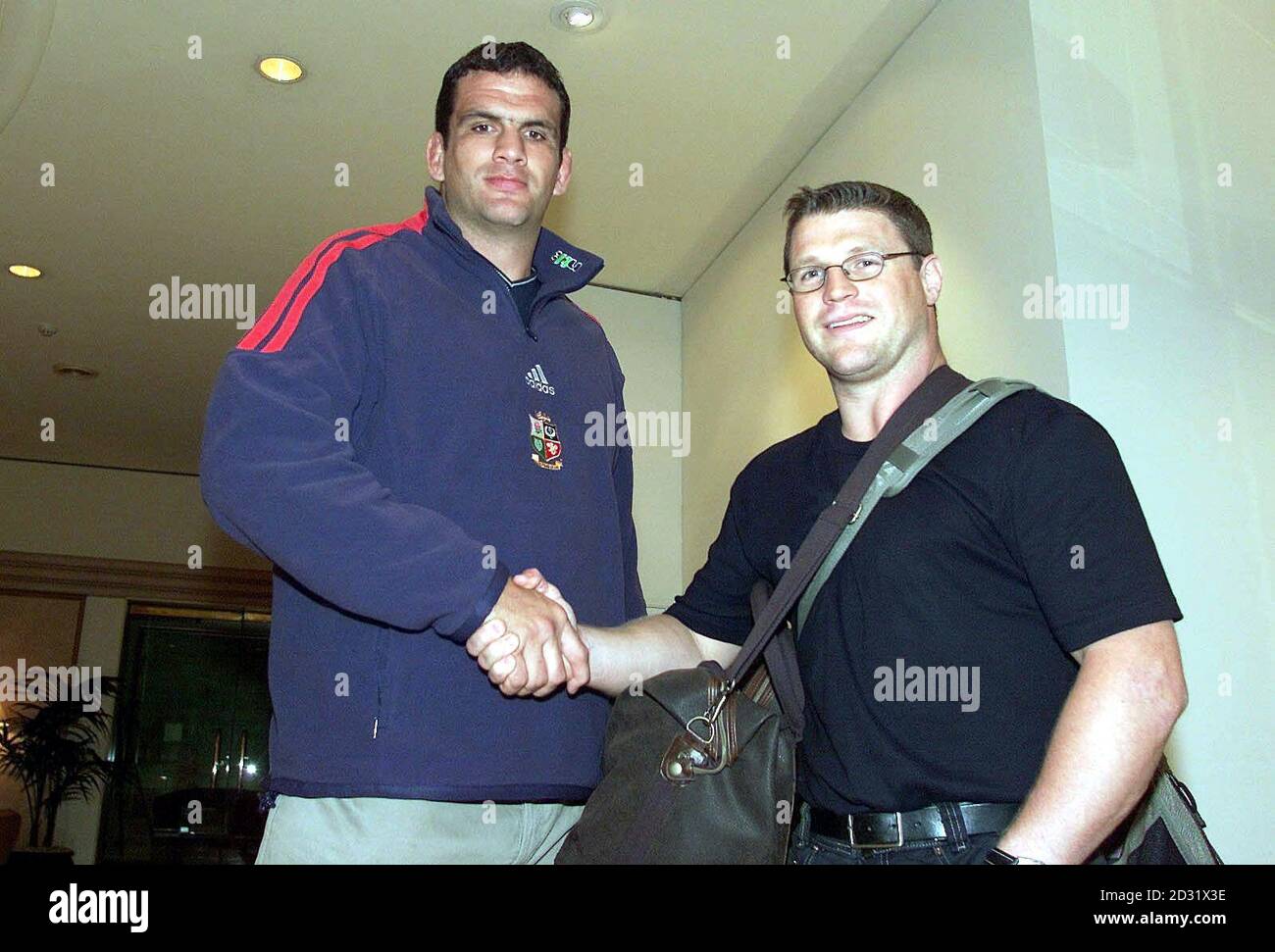 British & Irish Lions captain Martin Johnson (left) greets Scott Gibbs ...