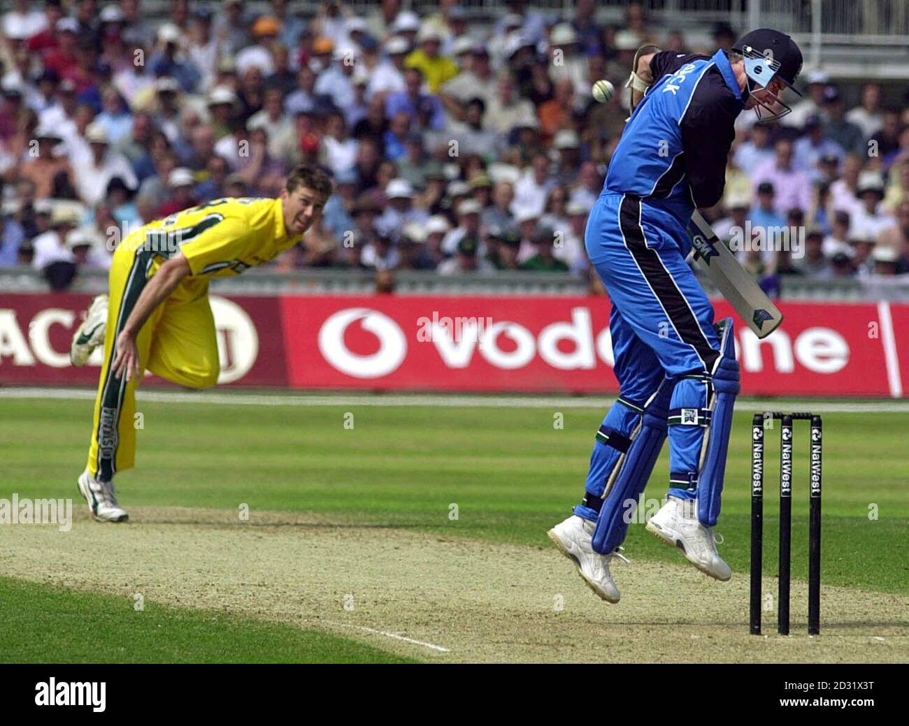 England's Andy Caddick (right) is struck on the back by a quick ...