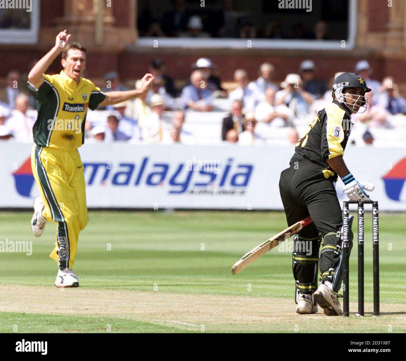 Australia's Glenn McGrath celebrates having Pakistan's Saleem Elahi ...