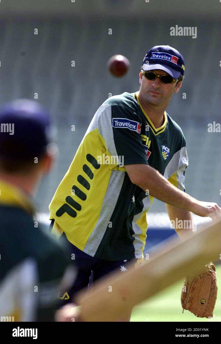 Australia's captain Steve Waugh warms up with throwing for slip ...