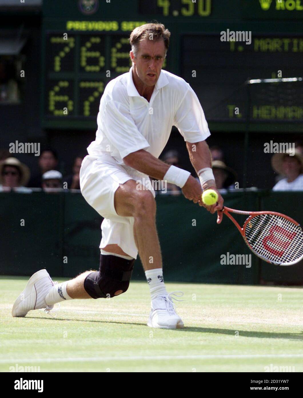 America's Todd Martin in action against Great Britain's Tim Henman ...