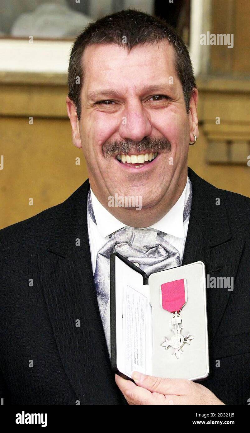 Dr. Carl Chinn after he received his MBE from Britain's Queen Elizabeth ...