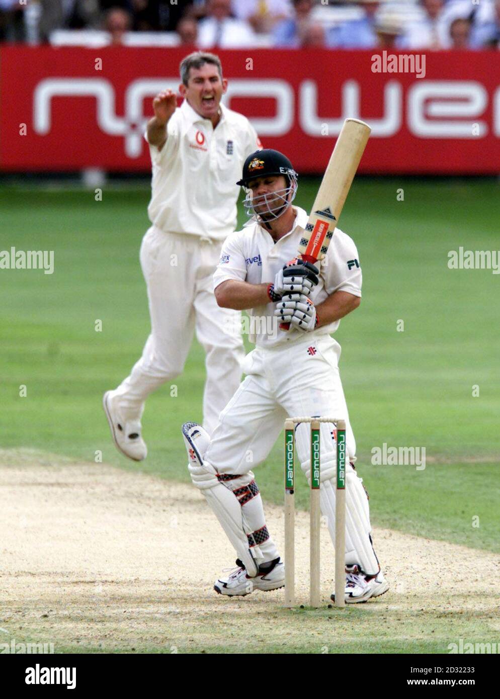 England's Andrew Caddick (left) celebrates after taking the wicket of ...