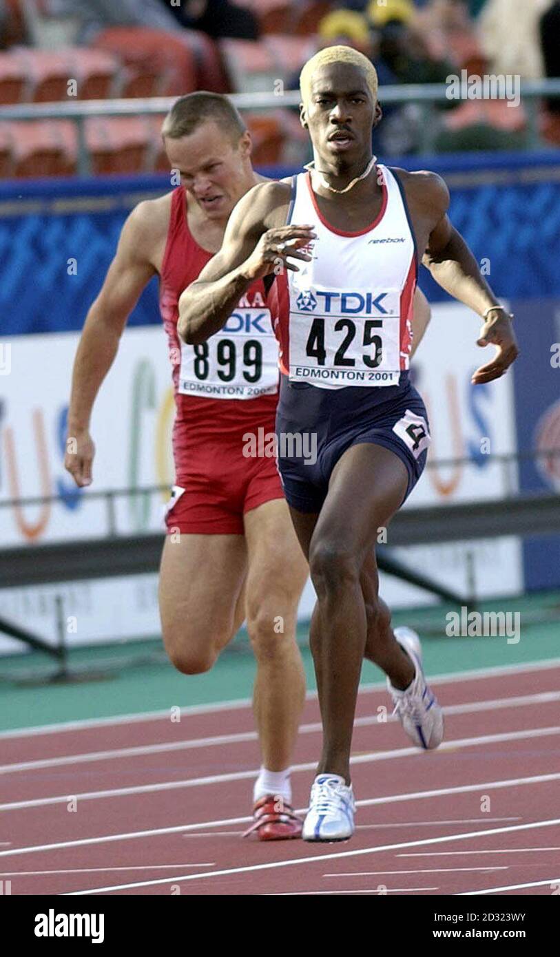 Great Britain's Christian Malcolm (right) wins with a personal best ...