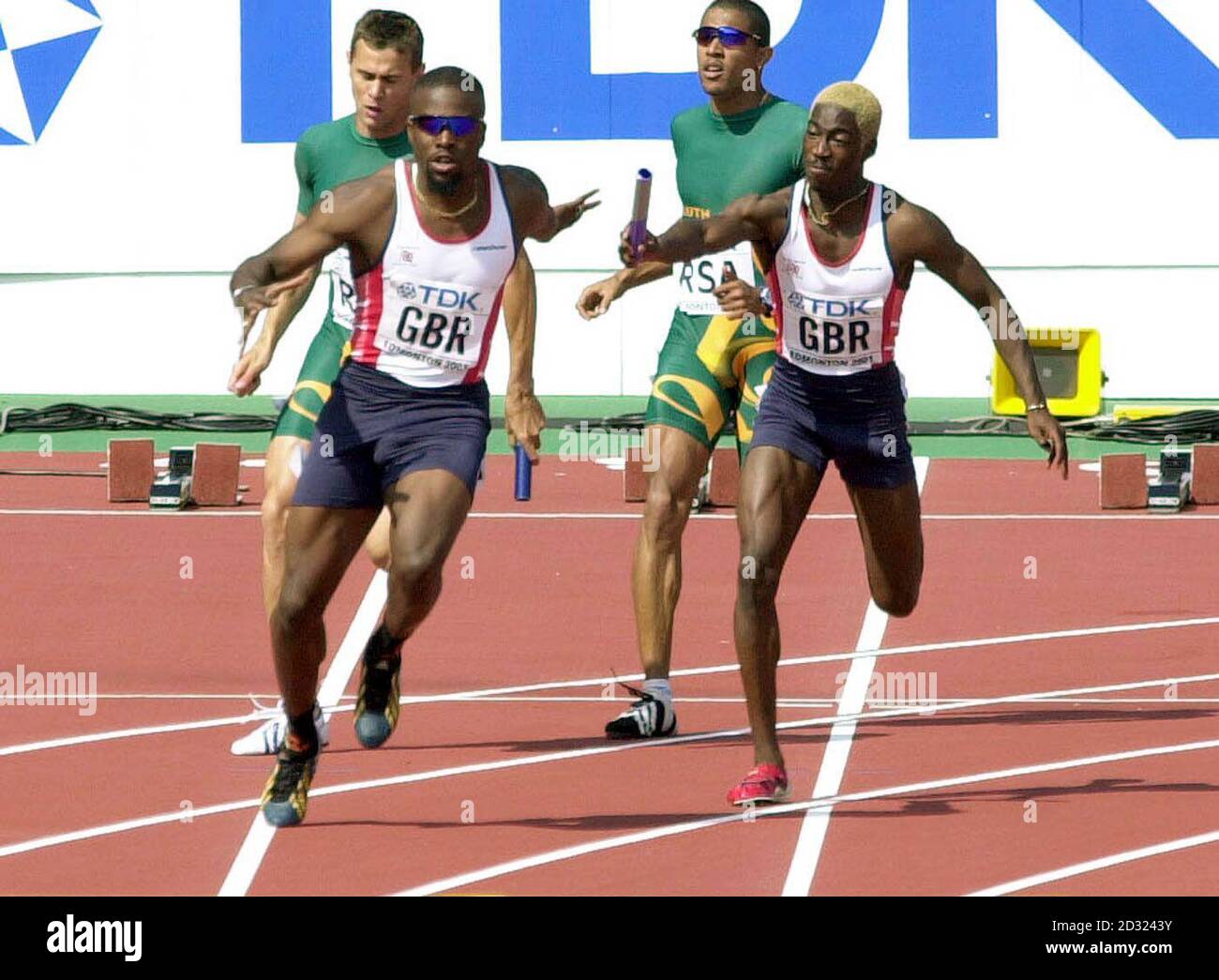 Great Britain's Christian Malcolm (right) fails to make the change to ...
