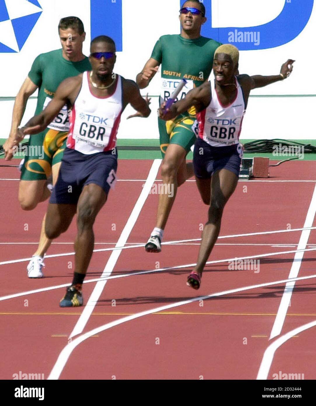 Great Britain's Christian Malcolm (right) fails to make the change to ...