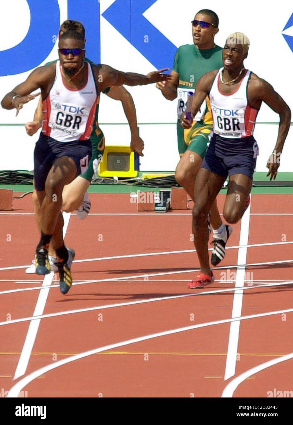 Great Britain's Christian Malcolm (right) fails to make the change to ...