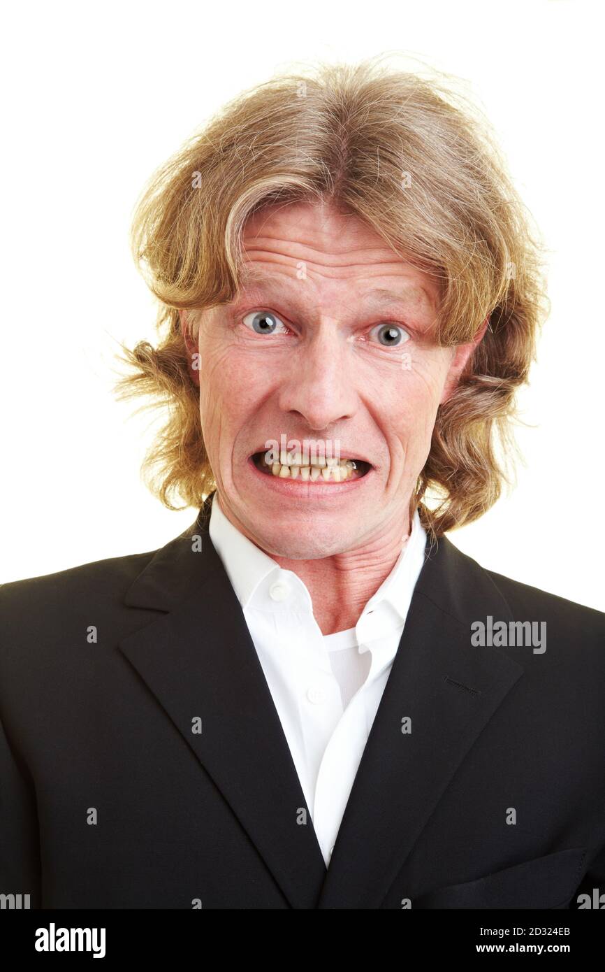 Businessman in a suit bares his teeth Stock Photo - Alamy