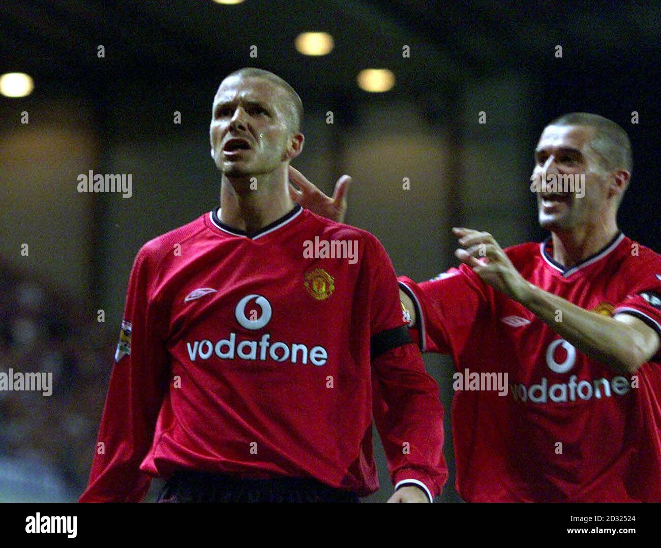 David beckham celebrates his goal with roy keane hi-res stock ...