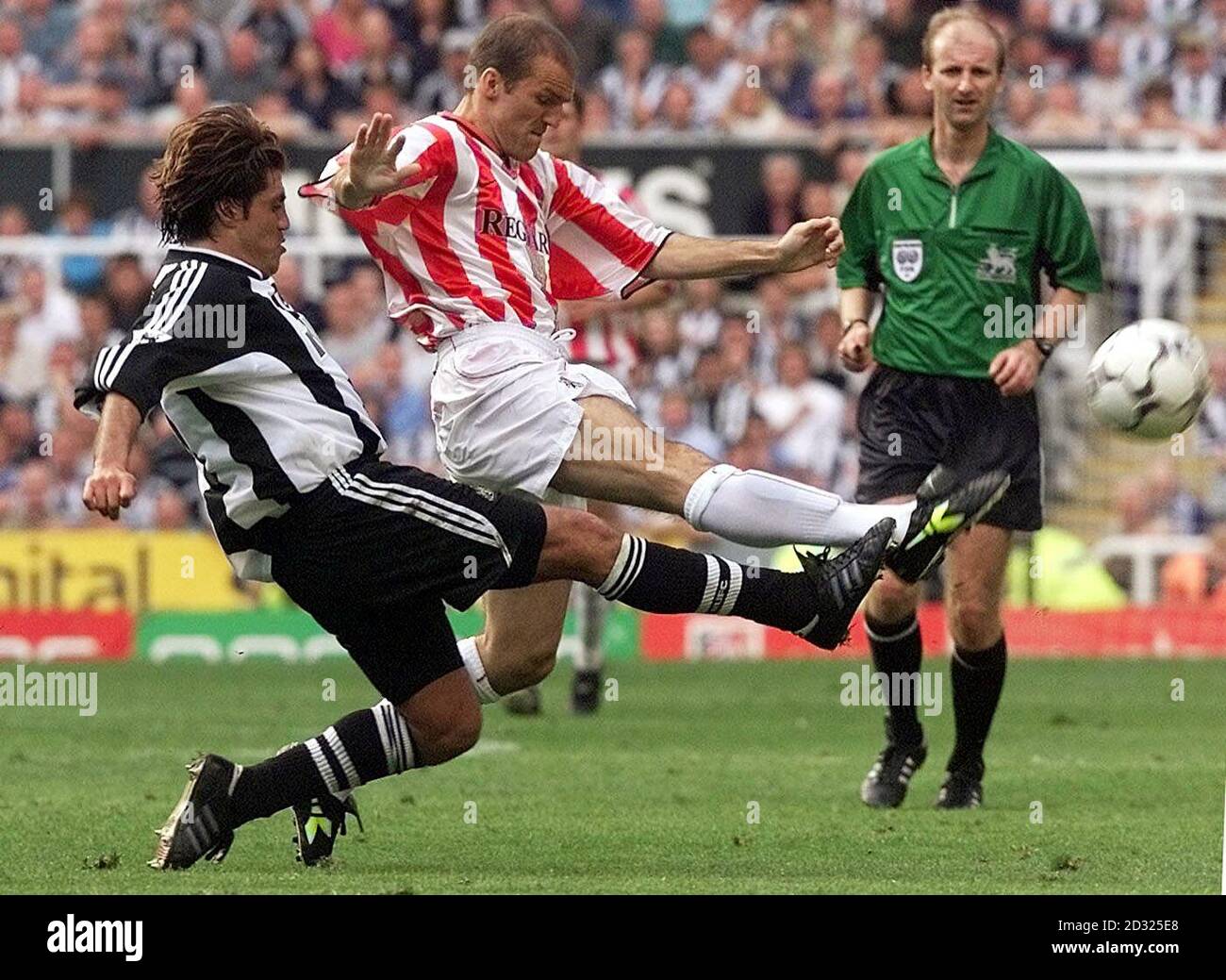 Newcastle United's Clarence Acuna (left) challenges Sunderland's Alex ...