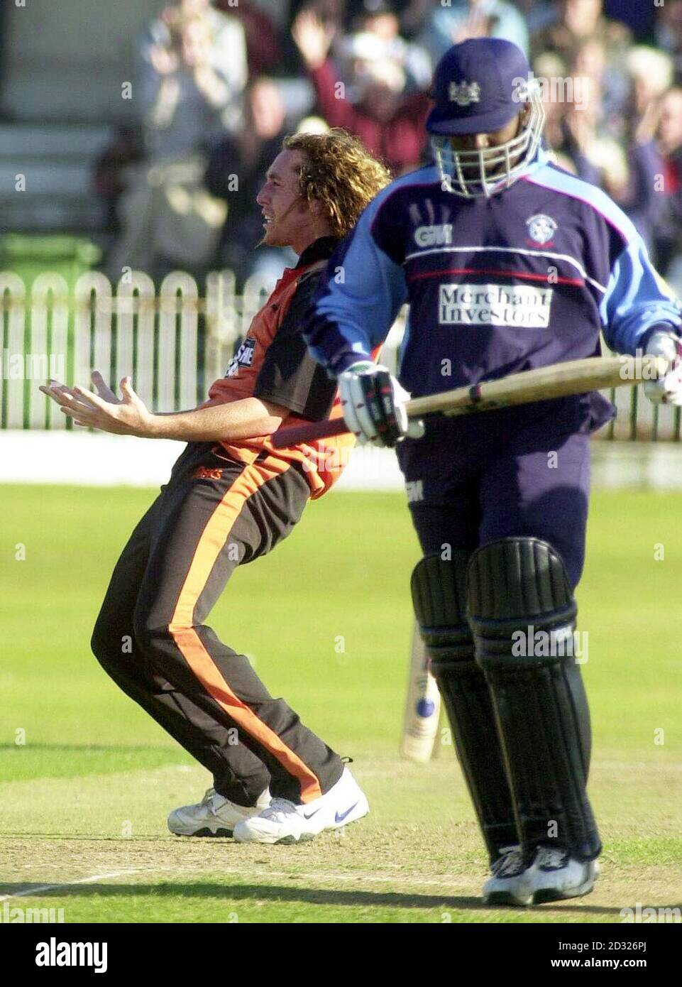 Yorkshire's Ryan Sidebottom (left) celebrates the wicket of ...