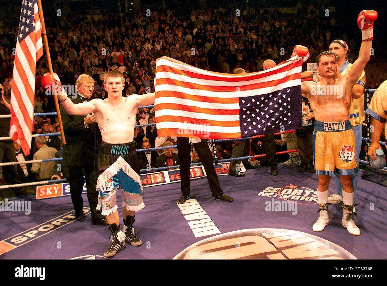 Ricky Hatton, left, who defeated Americas John Bailey, right, waves the ...