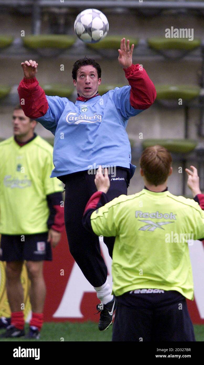 Liverpool's Robbie Fowler heads the ball during training at the ...