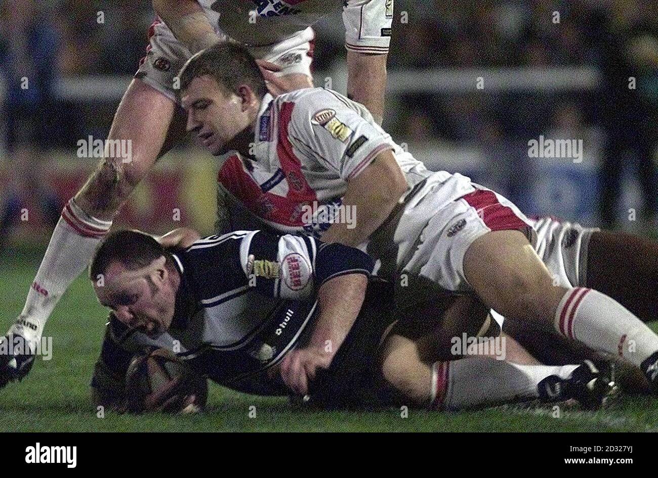 Hull FC's Paul Broadbent is tackled by St Helens's Tim Jonkers during ...
