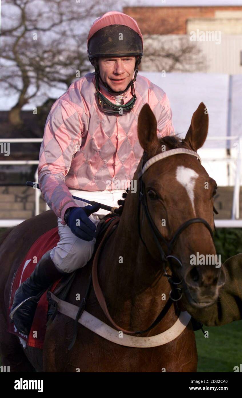 Jockey Mick Fitzgerald on Bacchanal after winning the The Aon Steeple ...