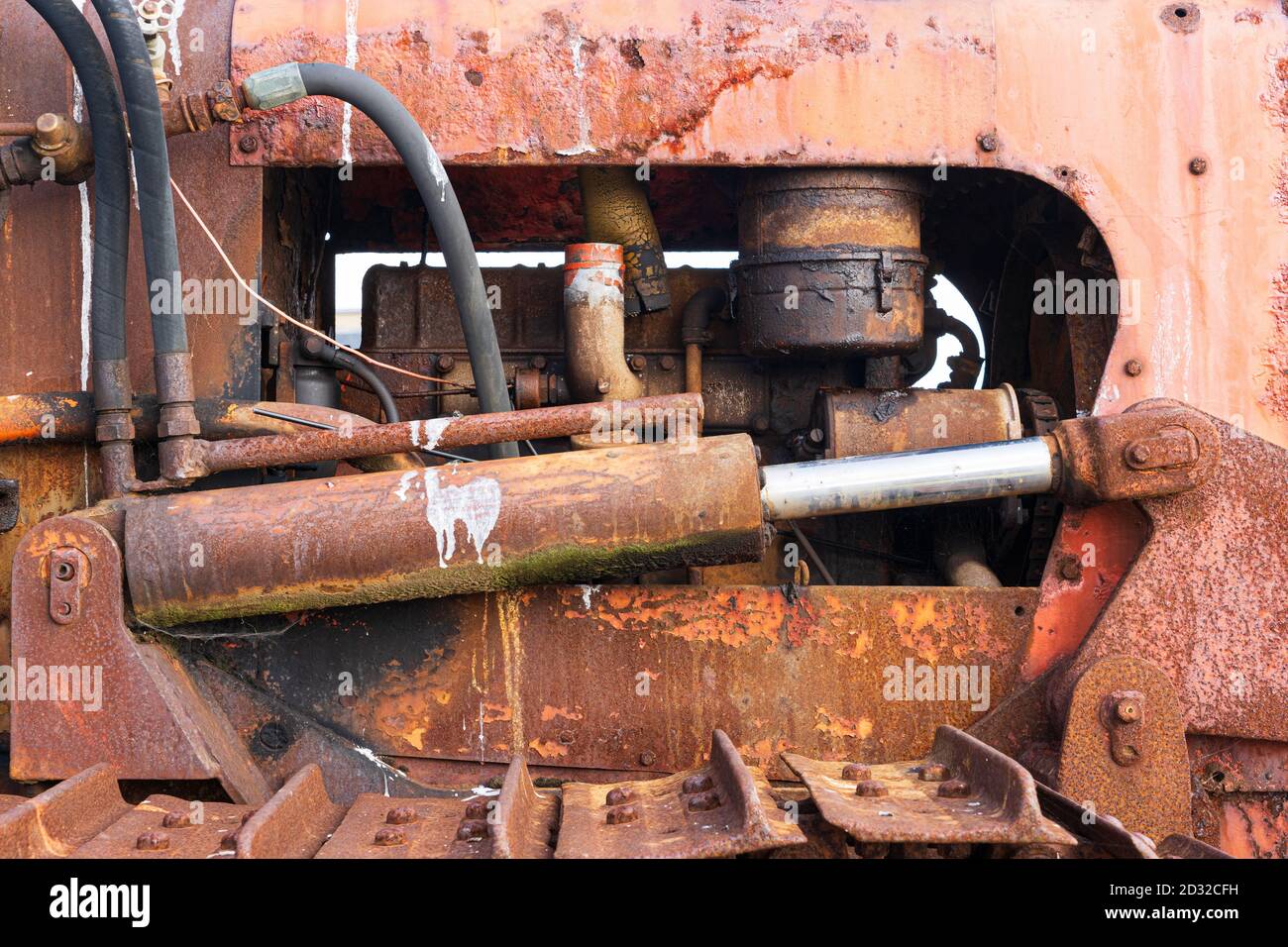 Engine of an old rusty, abandoned Marshall tractor located on the beach ...