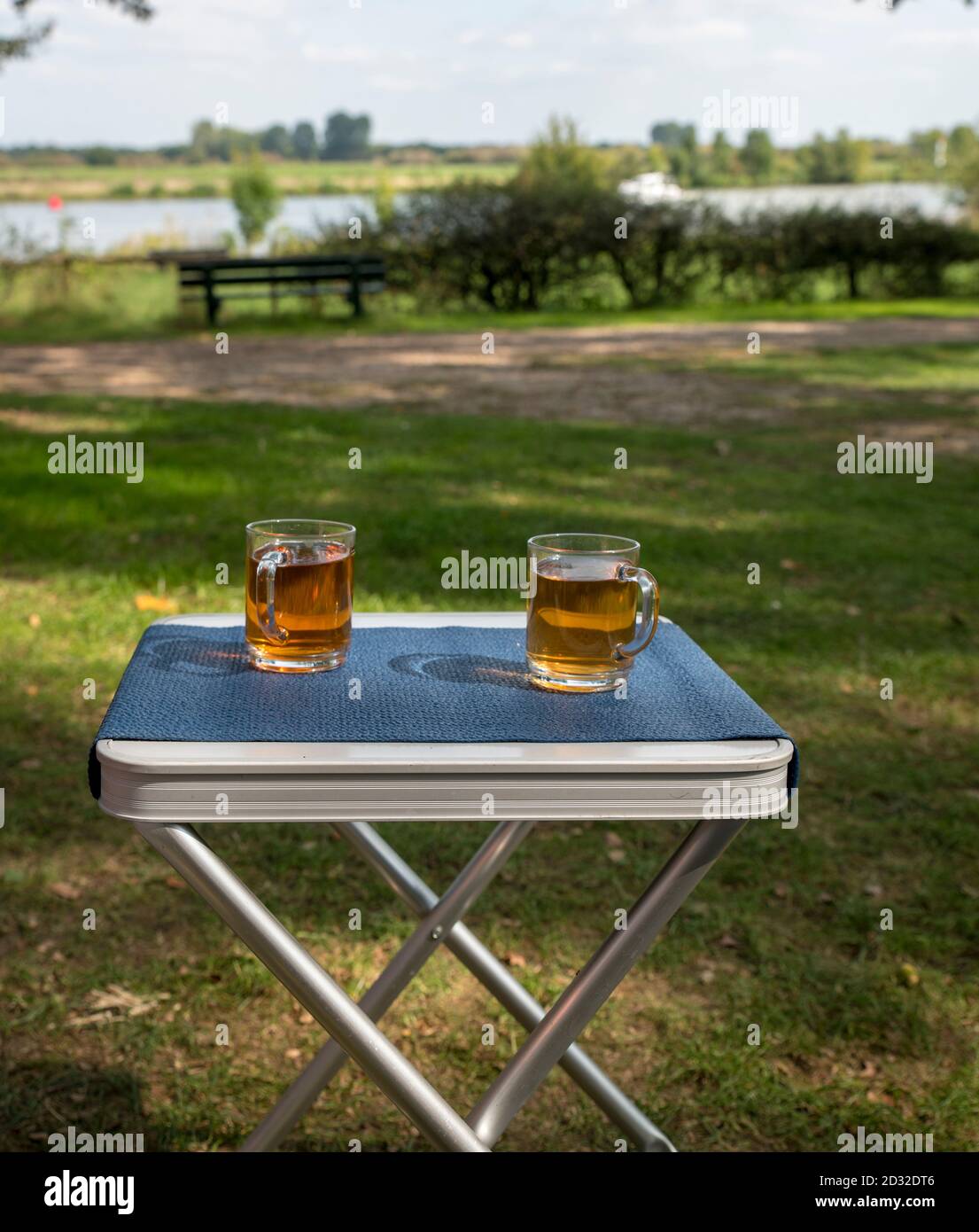 two glasses of tea during afternoon break outside on a table on the ...