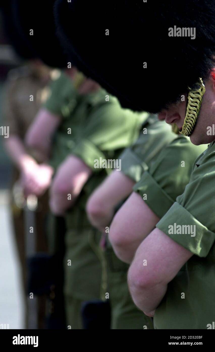 Members from Number 7 Company Coldstream Guards perform the reversed ...