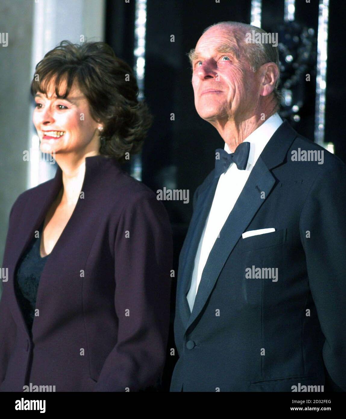Cherie, the wife of British Prime Minister Tony Blair, stands alongside ...