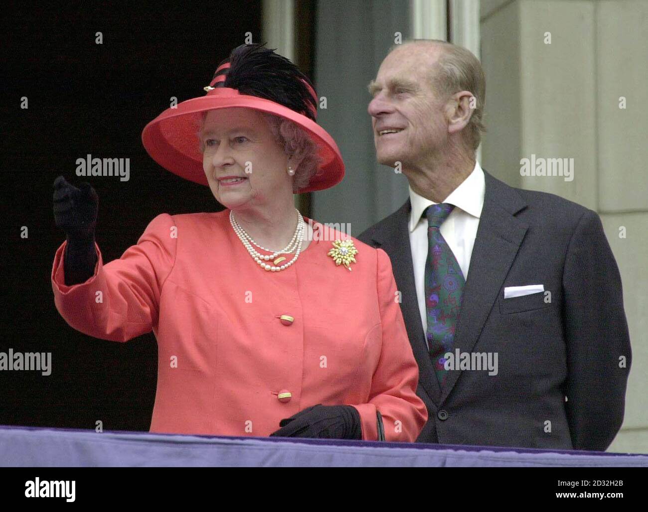 Queen Elizabeth II and the Duke of Edinburgh wave to crowds from the ...