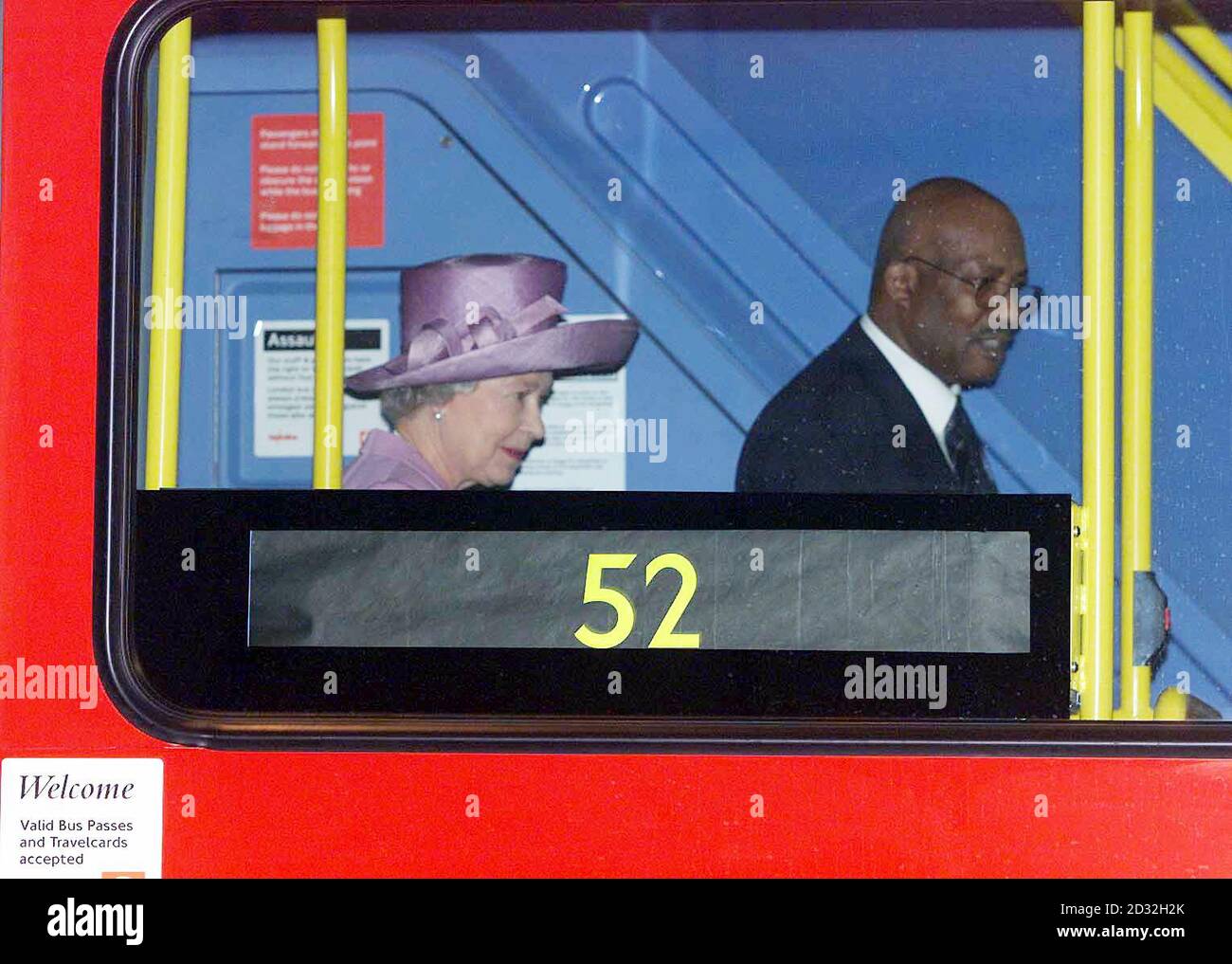 Queen Elizabeth II walks through a double decker bus with driver Eugene ...